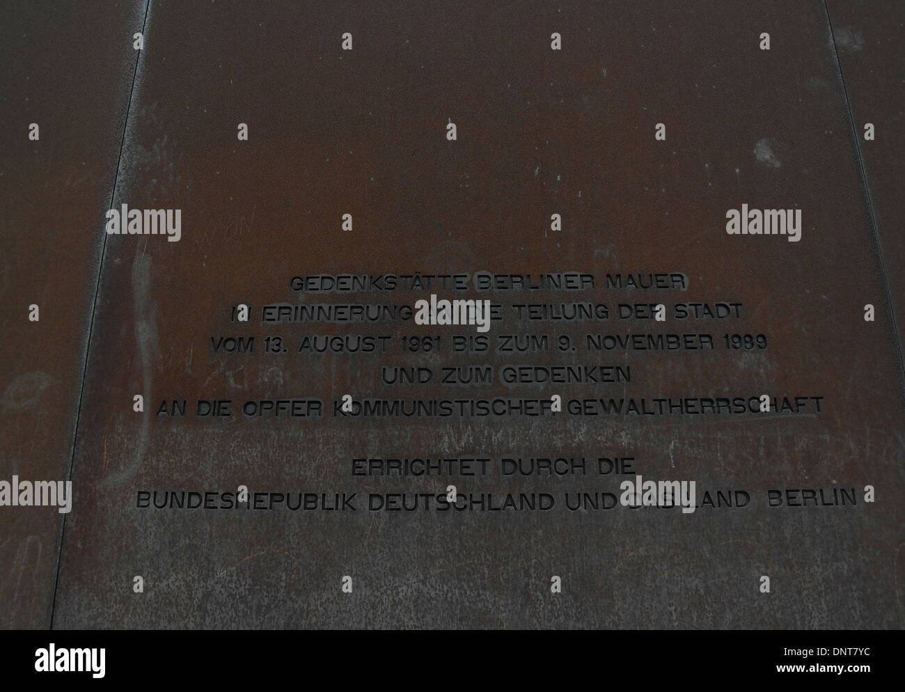 Corroded steel wall inscription to city divisions and communist tyranny ...
