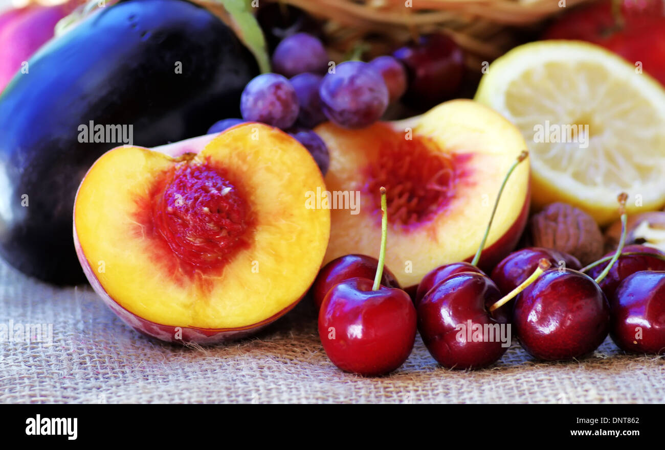 Sliced peach, berries and other fruits Stock Photo - Alamy