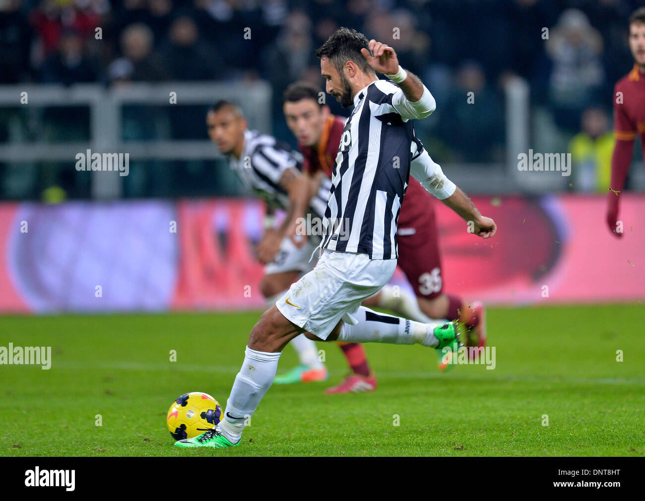 Turin, Italy. 6th Jan, 2014. Mirko Vucinic of Juventus takes a penalty ...