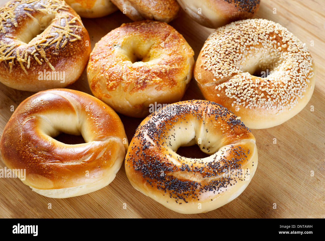 delicious assorted bagel on wood table Stock Photo - Alamy