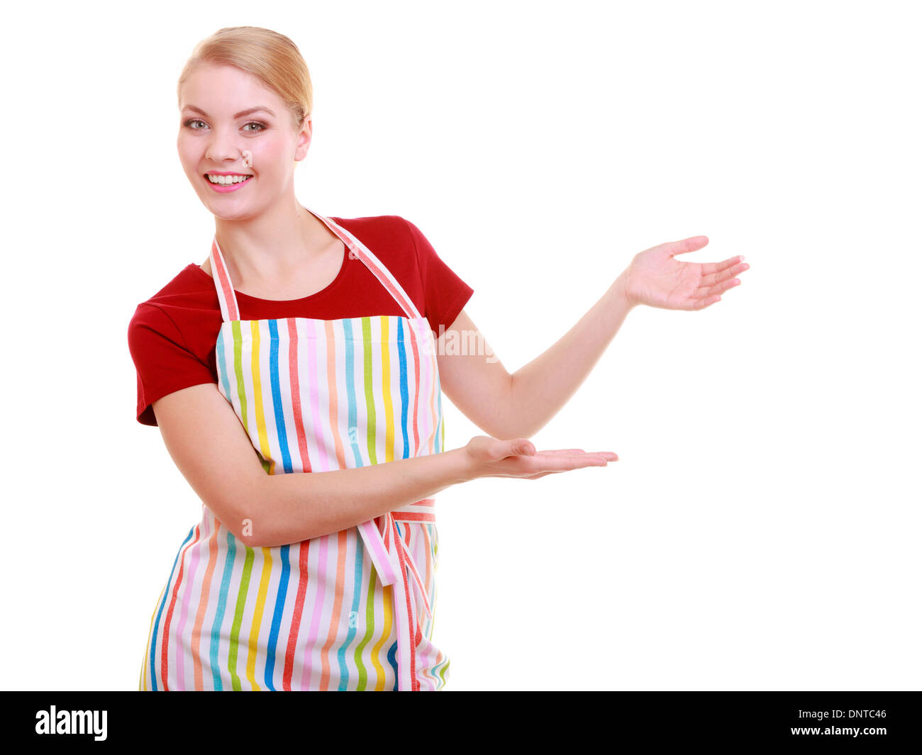 Housewife in colorful kitchen apron inviting making welcome gesture ...