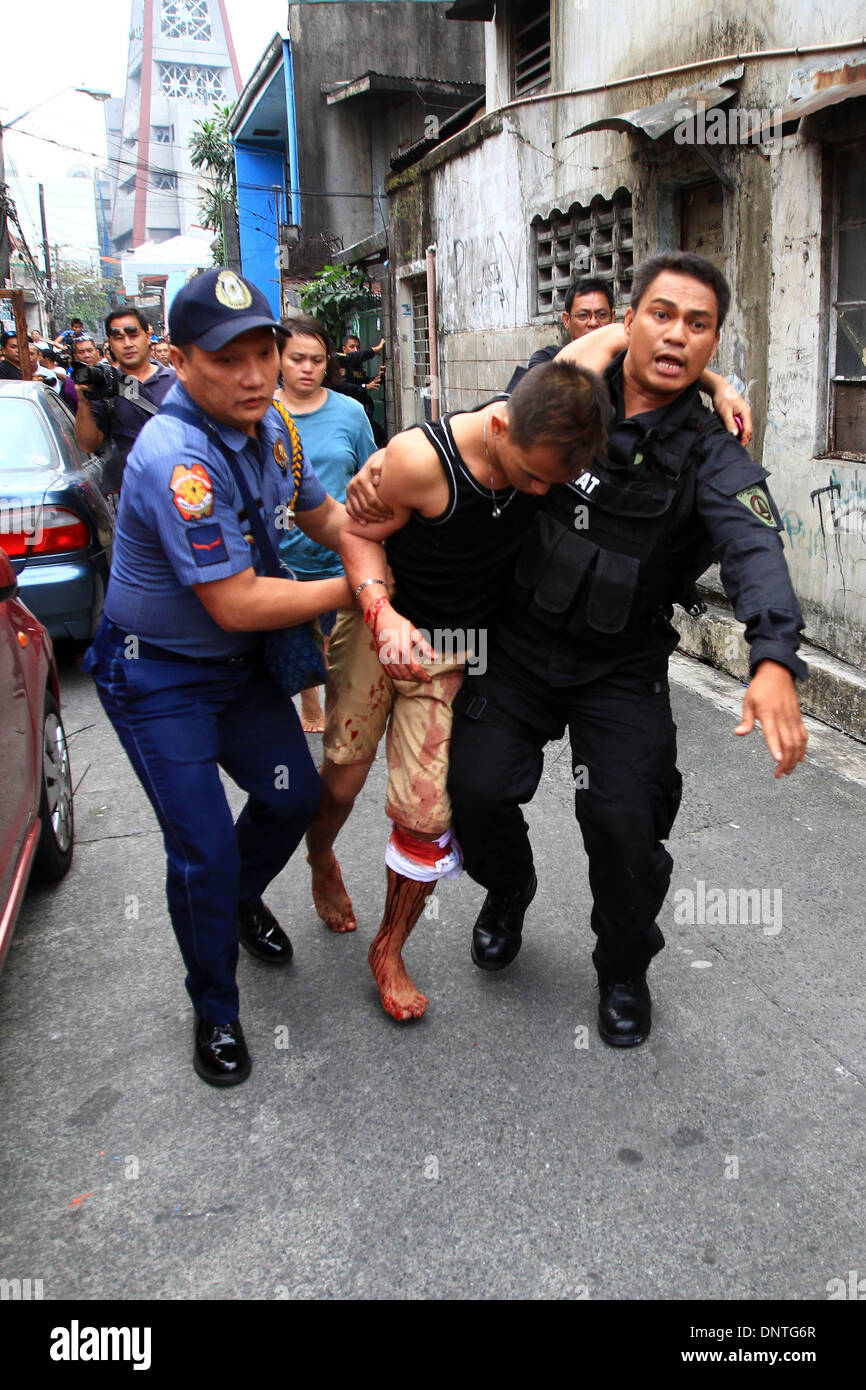 Quezon City, Philippines. 6th Jan, 2014. An injured hostage victim is ...