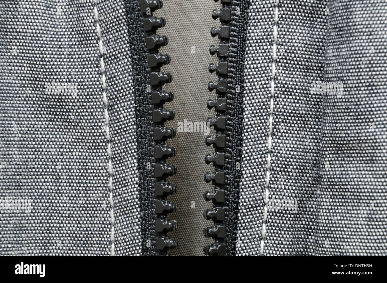 fragment of open plastic zipper fastener of gray cotton jacket Stock ...