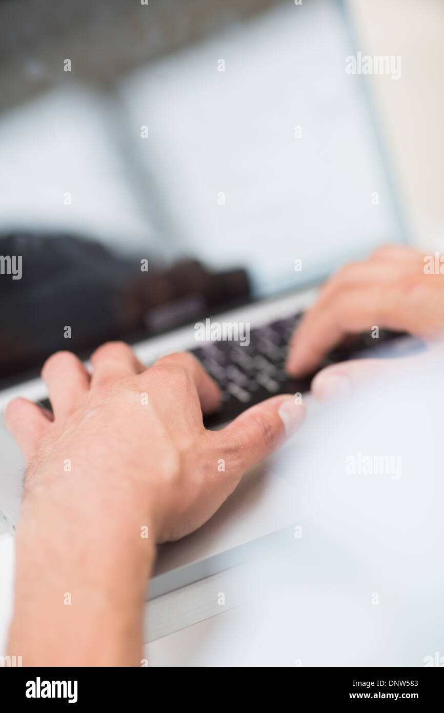 Hands using blurred laptop keyboard Stock Photo - Alamy