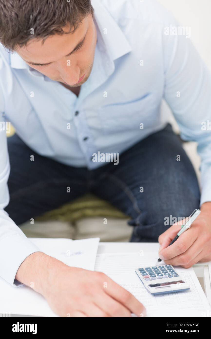 Man paperwork calculator hi-res stock photography and images - Alamy