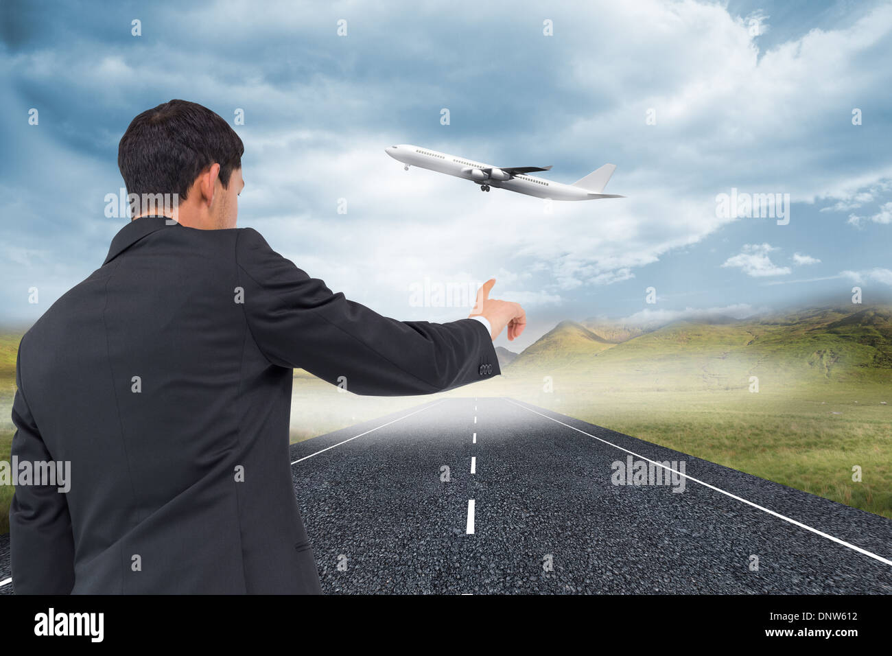 Composite image of asian businessman pointing Stock Photo - Alamy