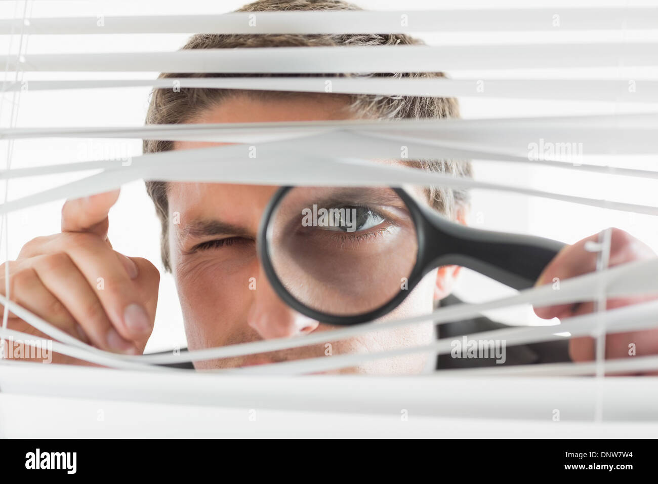 Peeking through blinds hi-res stock photography and images - Alamy
