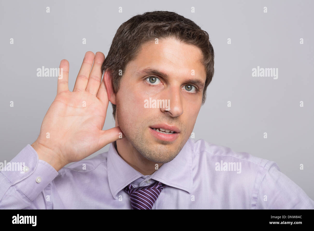 Hand at ear hi-res stock photography and images - Alamy