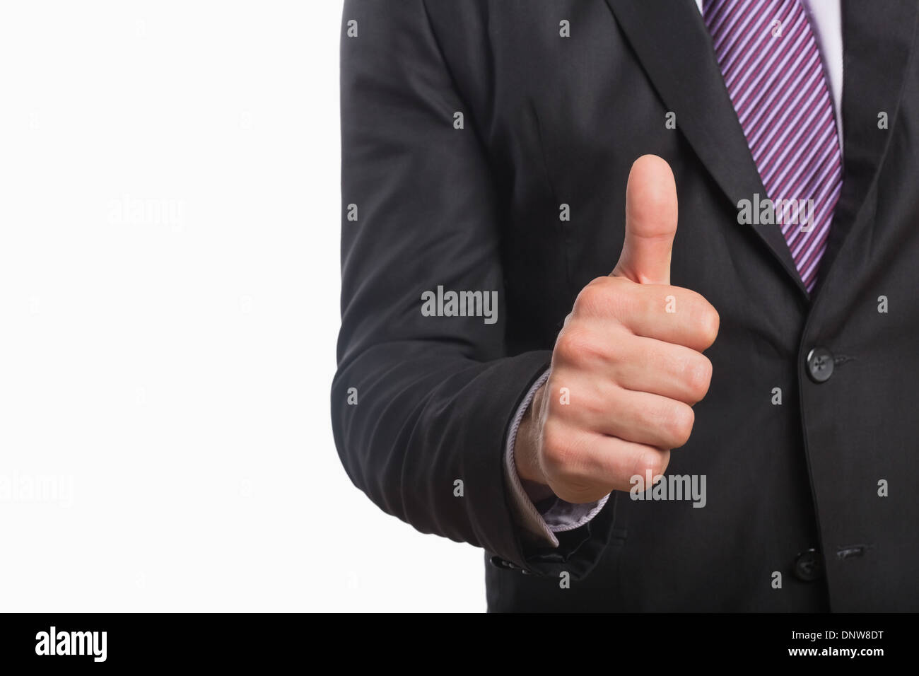 Mid section of a businessman gesturing thumbs up Stock Photo - Alamy