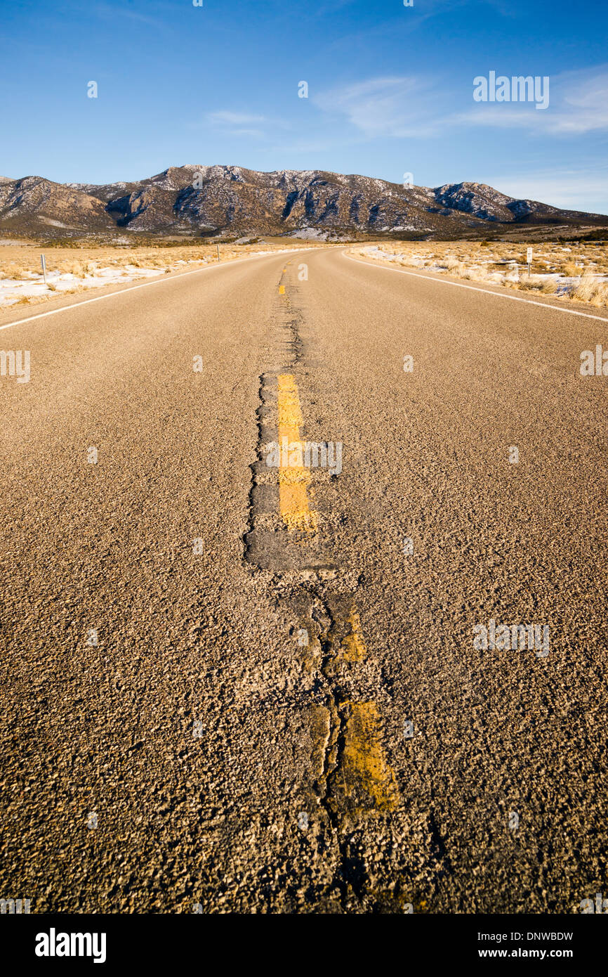 Vertical blue sky two lane road southwest landscape Stock Photo - Alamy