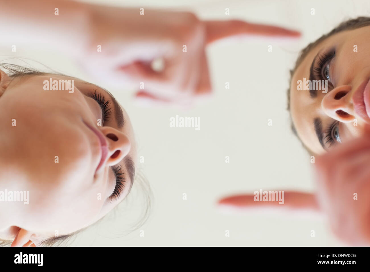 Low angle view of angry young females having an argument Stock Photo ...