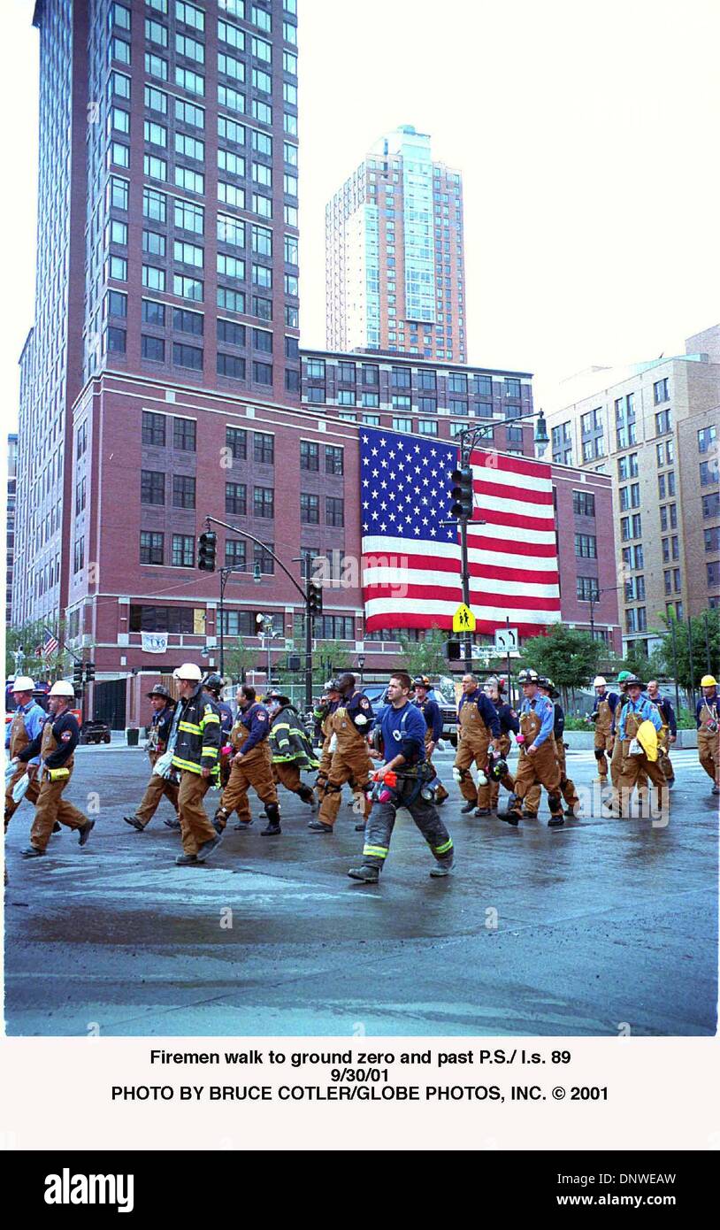June 24, 2002 - Firemen walk to ground zero and past P.S./ I.s. 89.9/30 ...