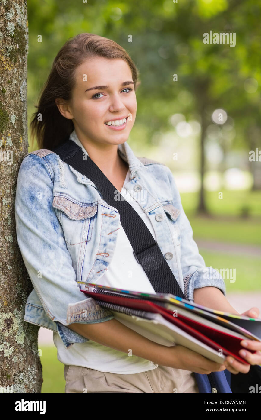 Young student holding books hi-res stock photography and images - Alamy