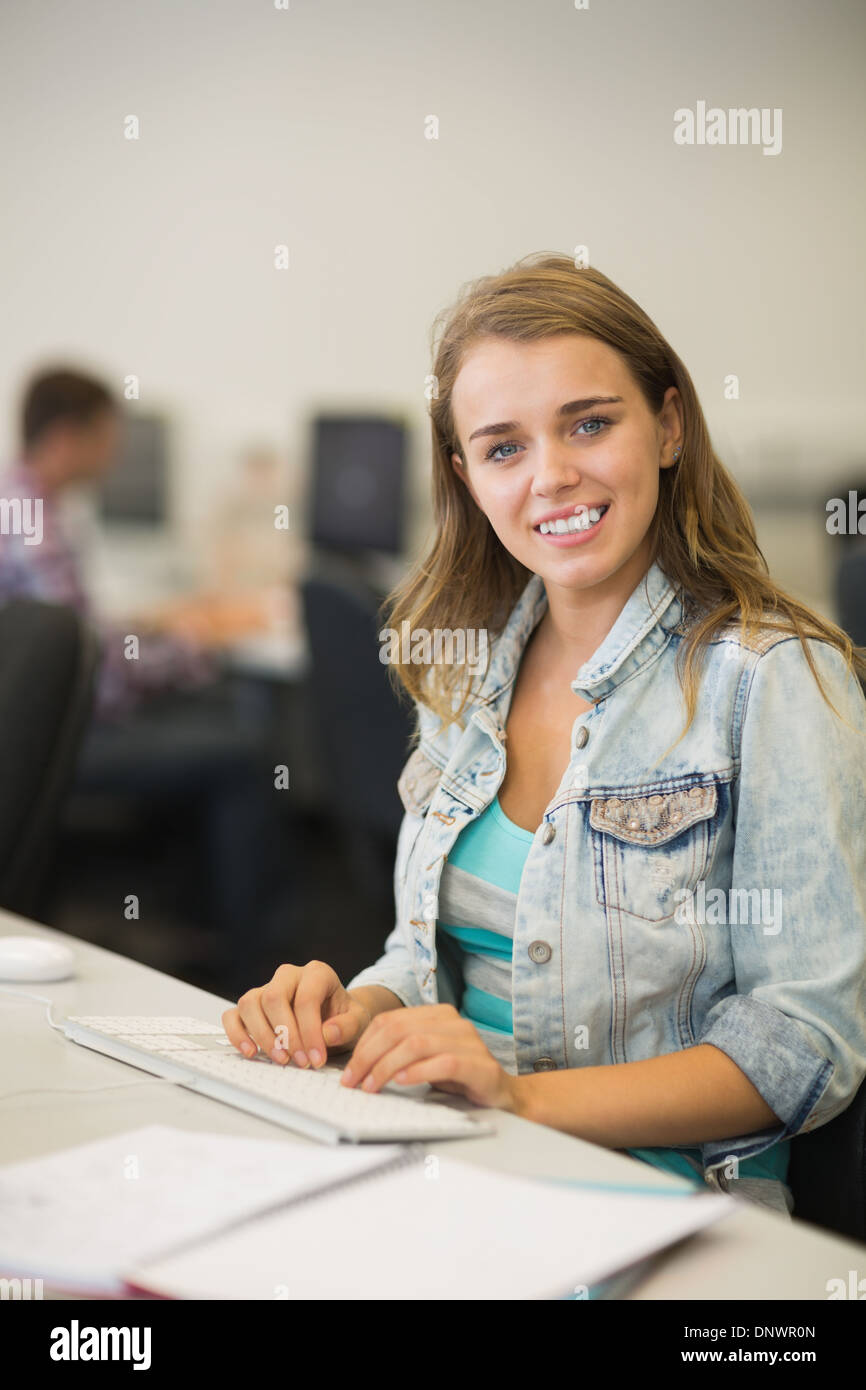 Happy young student studying in the computer room Stock Photo - Alamy