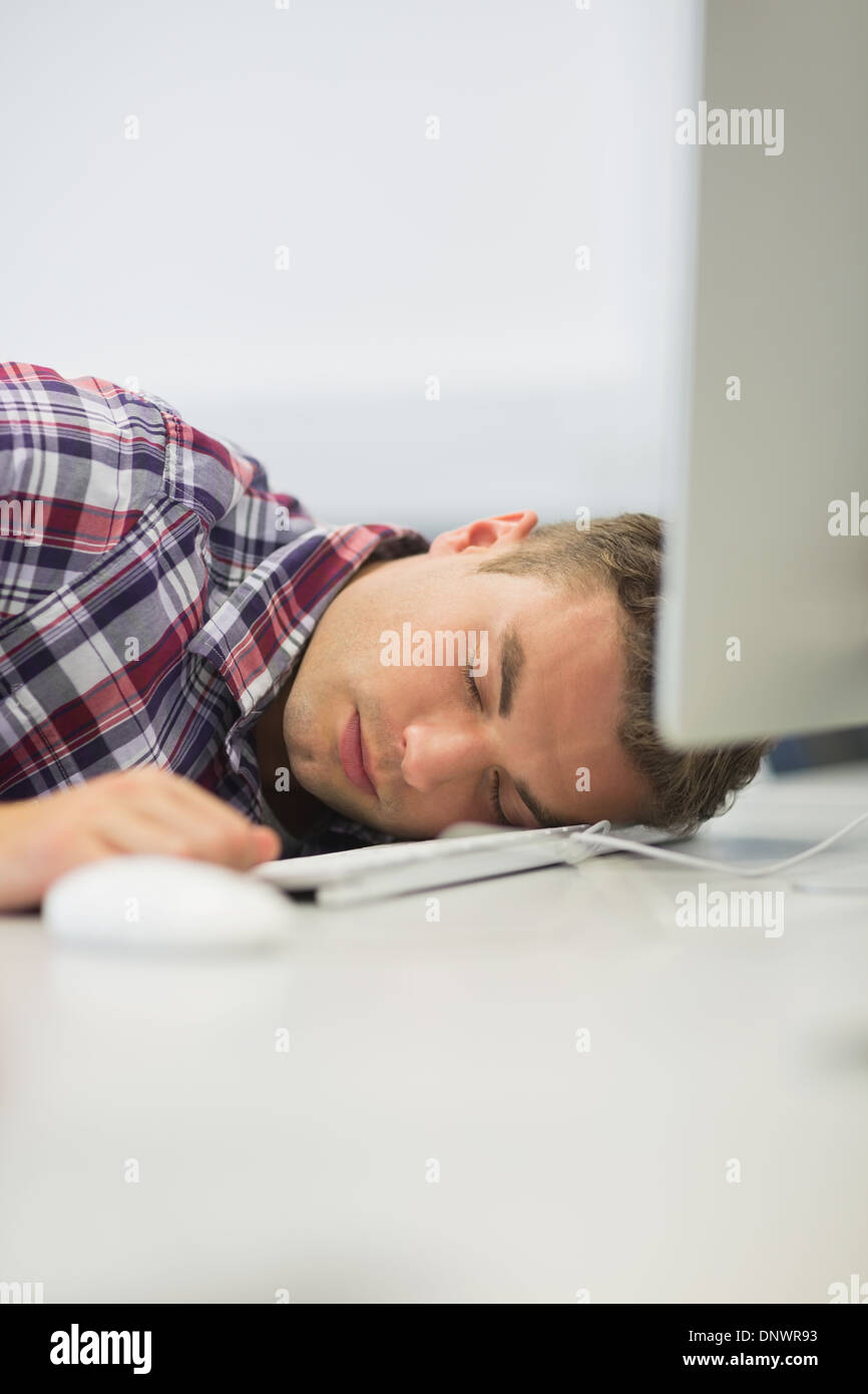 Student sleeping in the computer room Stock Photo - Alamy