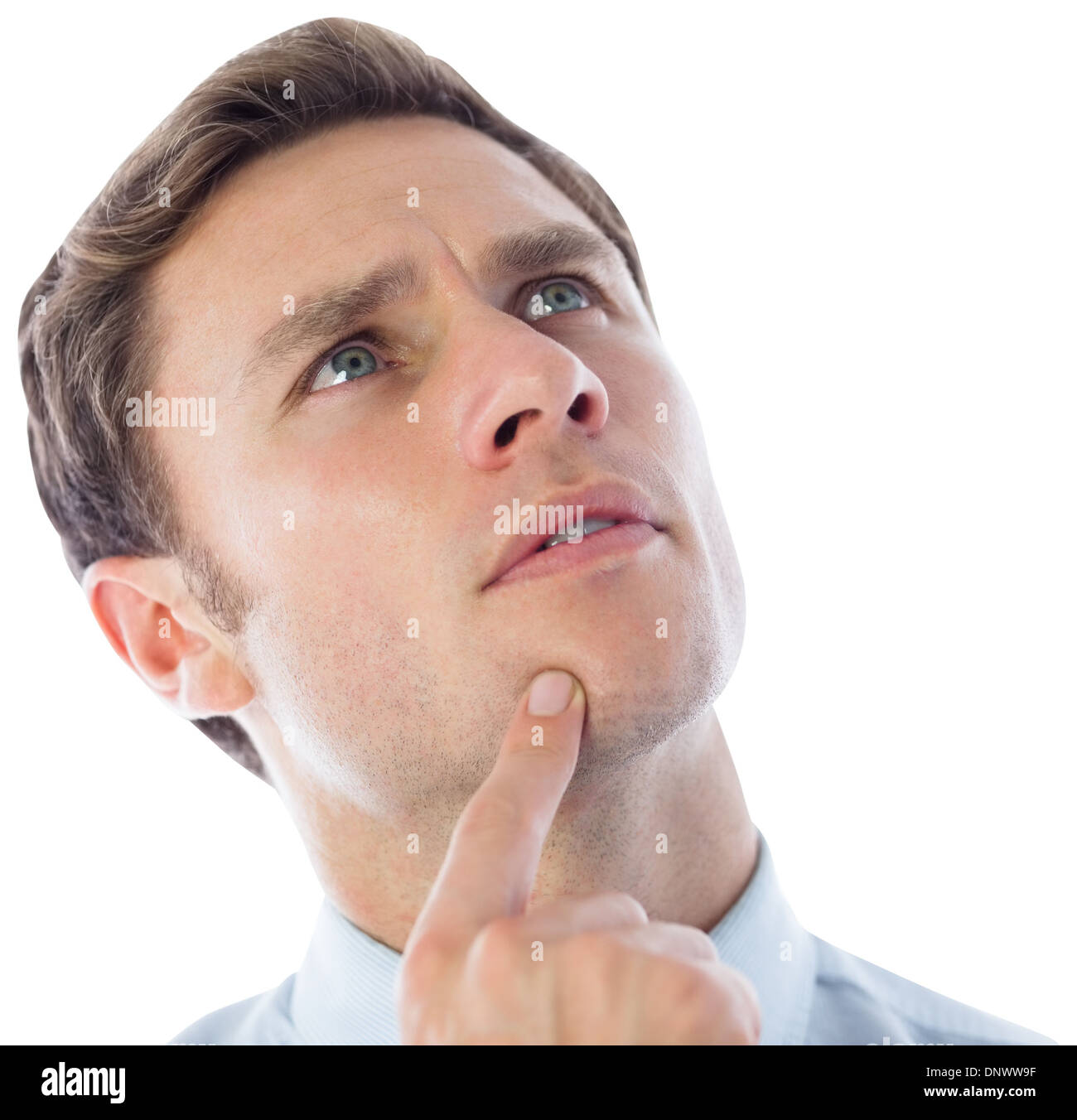 Thinking businessman with finger on chin Stock Photo - Alamy