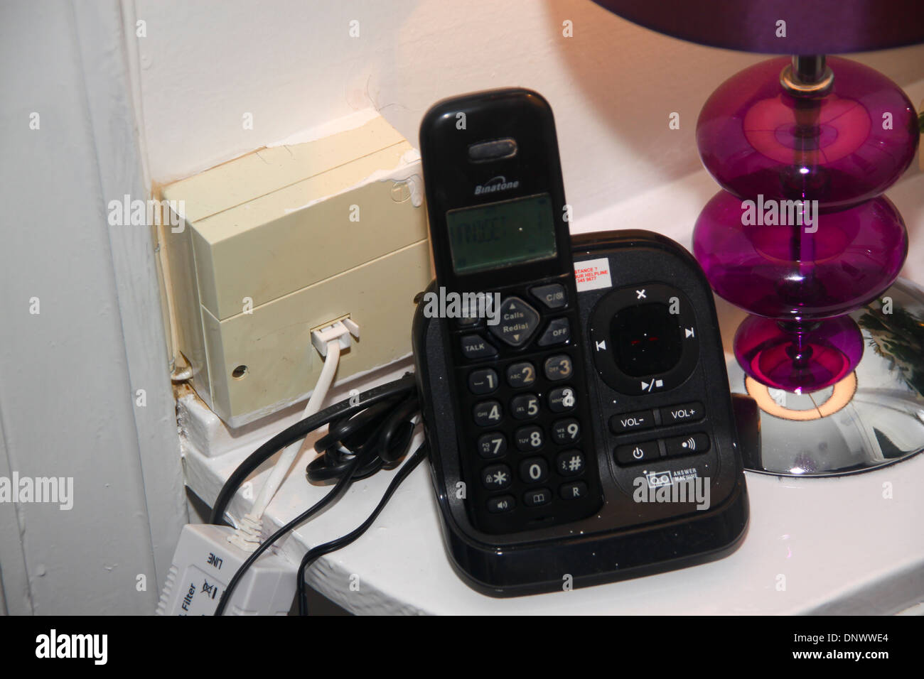 Binatone cordless telephone handset on base station Stock Photo - Alamy