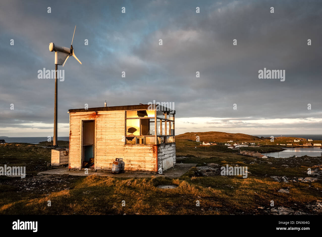 old coastguard lookout hut and wind turbine on Out Skerries in Shetland ...