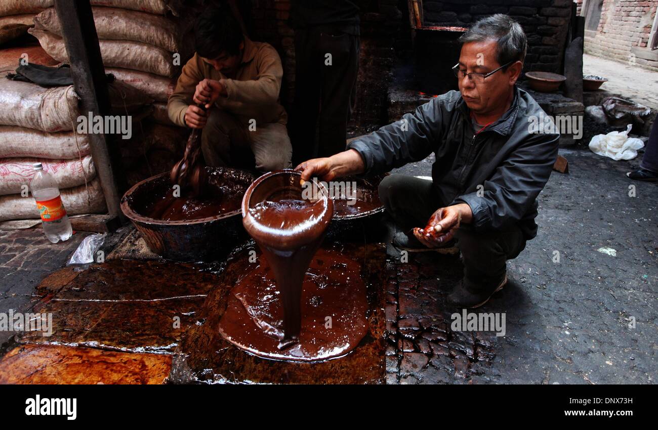 Kathmandu, Nepal. 6th Jan, 2014. Locals prepare molasses (Chaku in ...