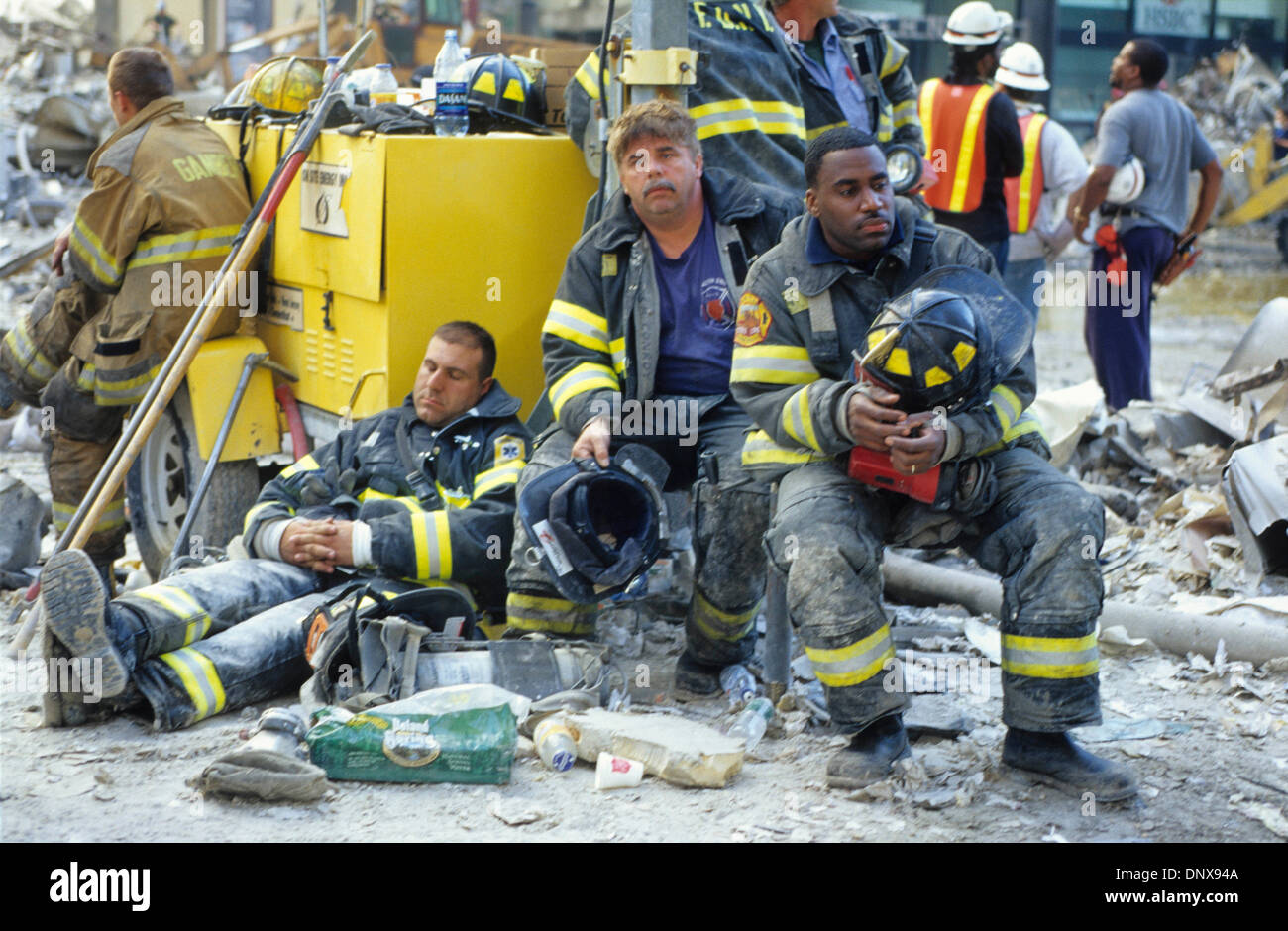 Sep. 12, 2001 - New York, New York, U.S. - Exhausted firefighters ...