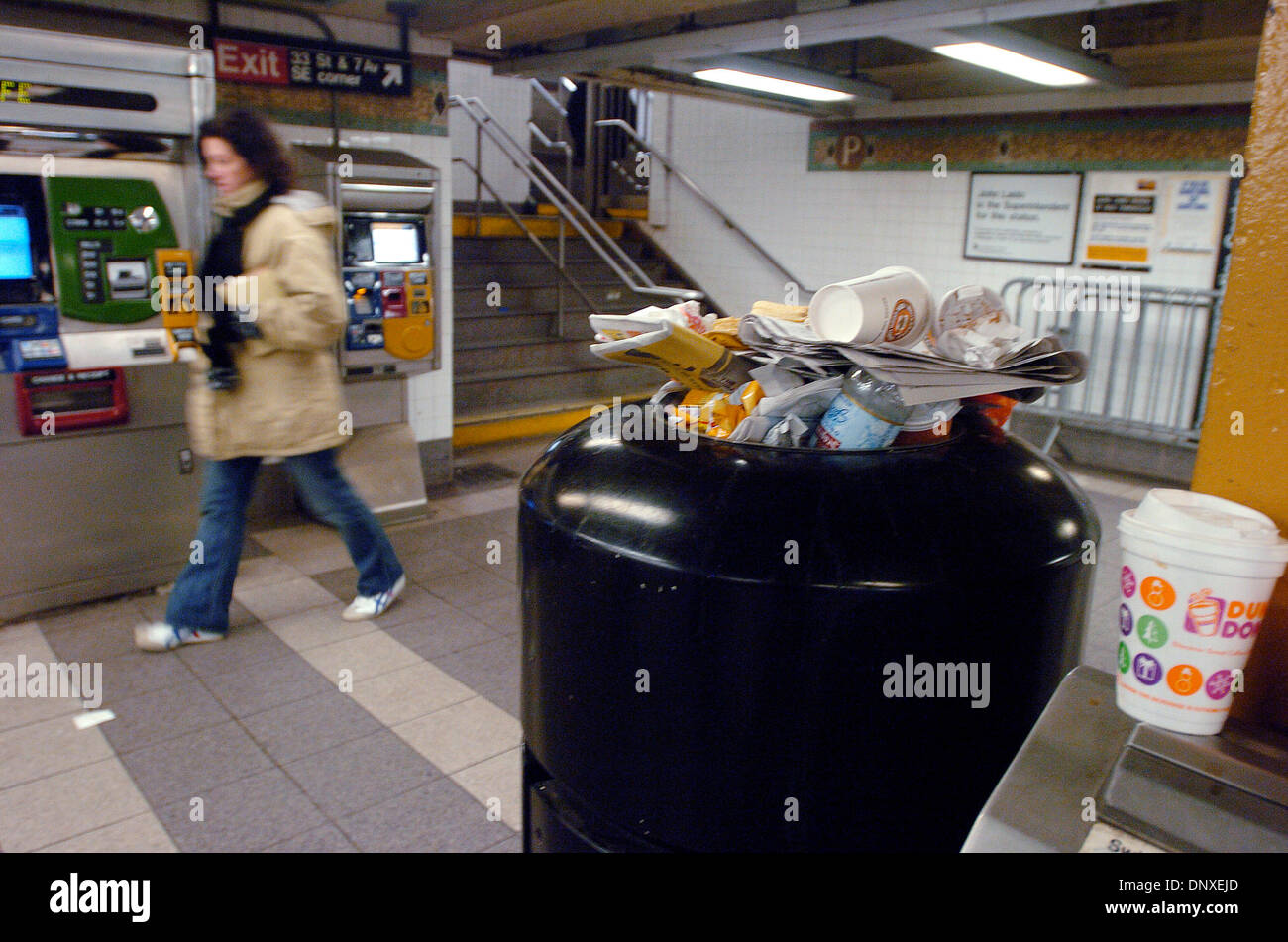Dec 07, 2005; Manhattan, New York, USA; Garbage spills out of a trash ...