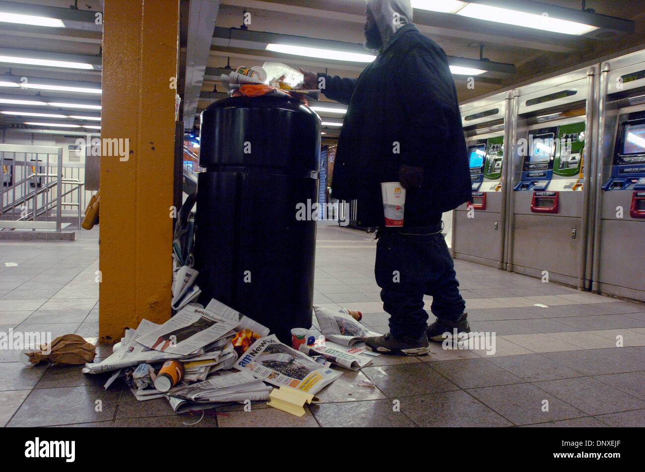 Dec 07, 2005; Manhattan, New York, USA; Garbage spills out of a trash ...