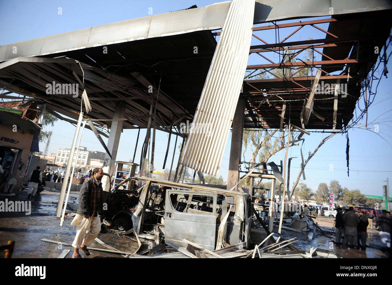 People gather at the site after an explosion in a Compressed Natural ...