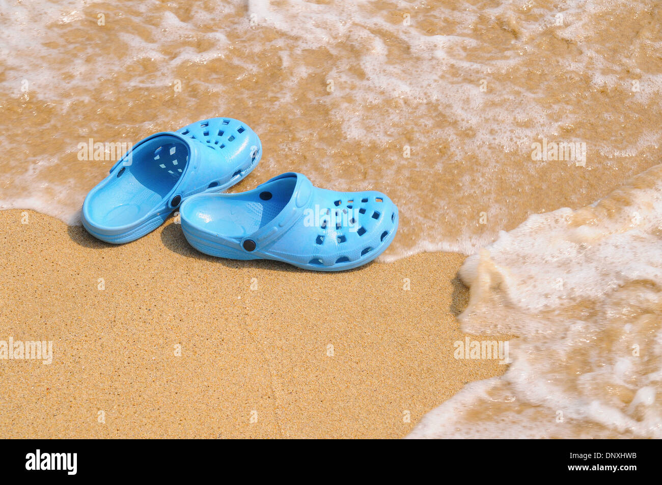 Blue sandals on the beach Stock Photo - Alamy