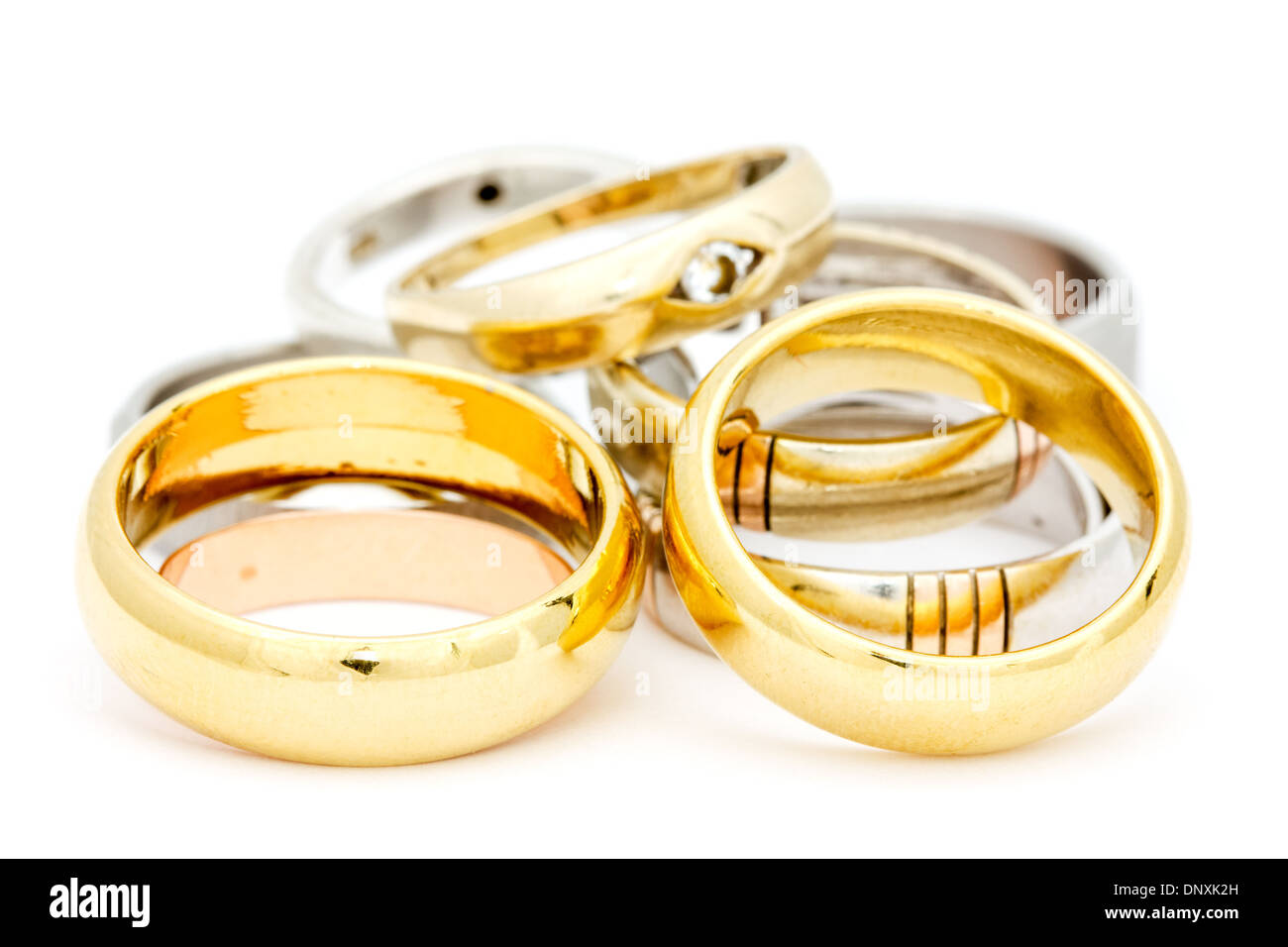 Pile of gold jewelry isolated on white background Stock Photo - Alamy