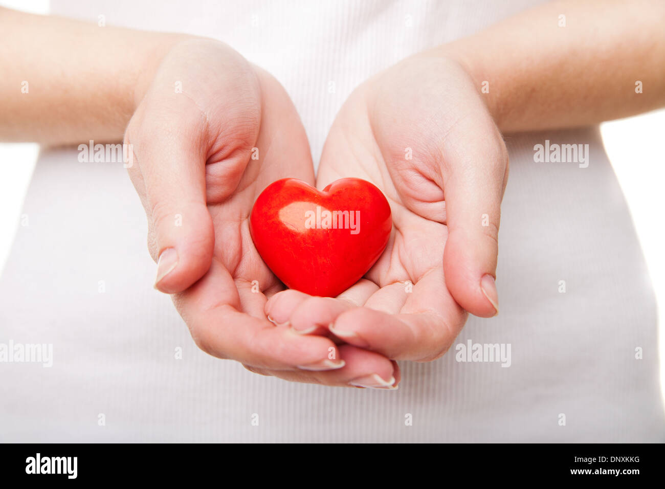 Woman's hand with heart symbol isolated on white Stock Photo - Alamy
