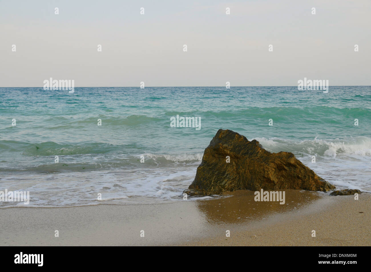 Rock on the beach Stock Photo - Alamy