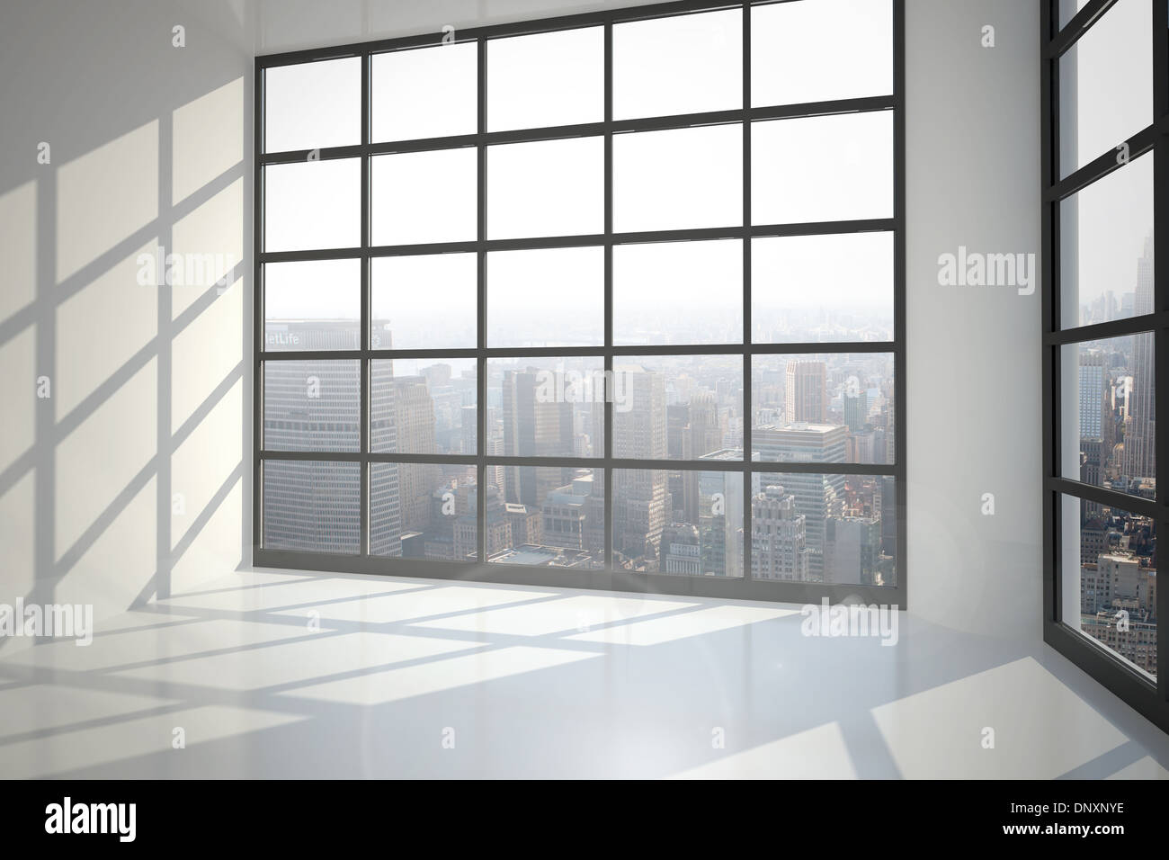 Room with large window showing city Stock Photo - Alamy