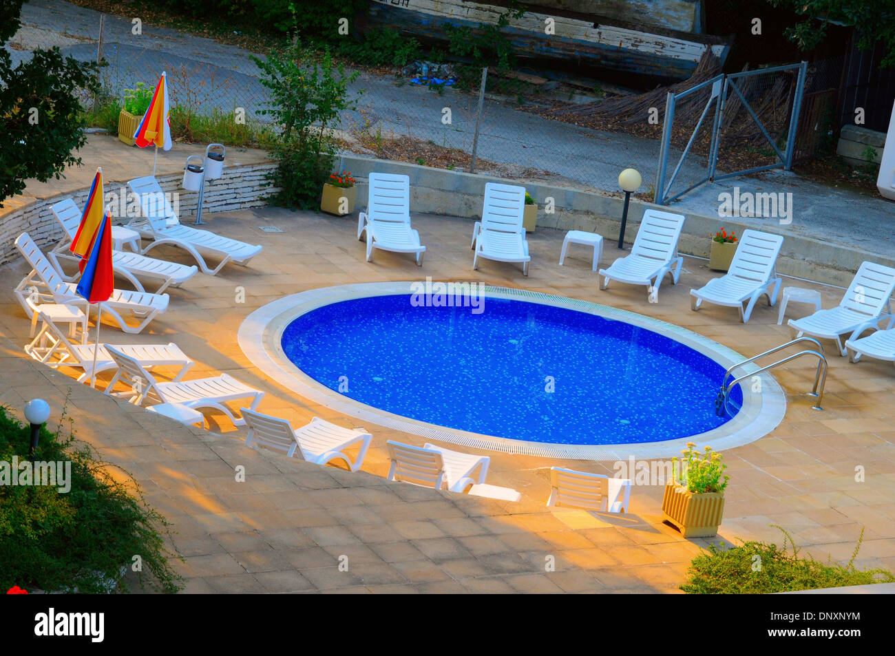 Swimming pool and chairs top view Stock Photo - Alamy