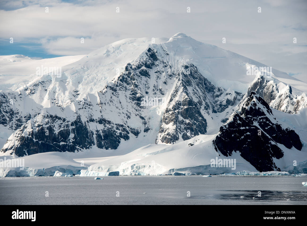 GERLACHE STRAIT, Antarctica — Snow and ice-covered mountains tower over ...