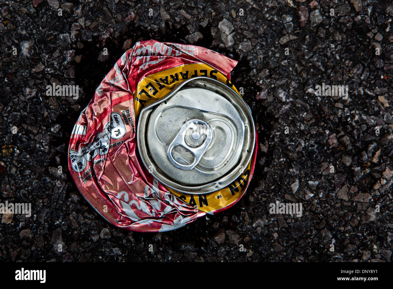 Squashed Coca Cola aluminium can on the road Stock Photo - Alamy