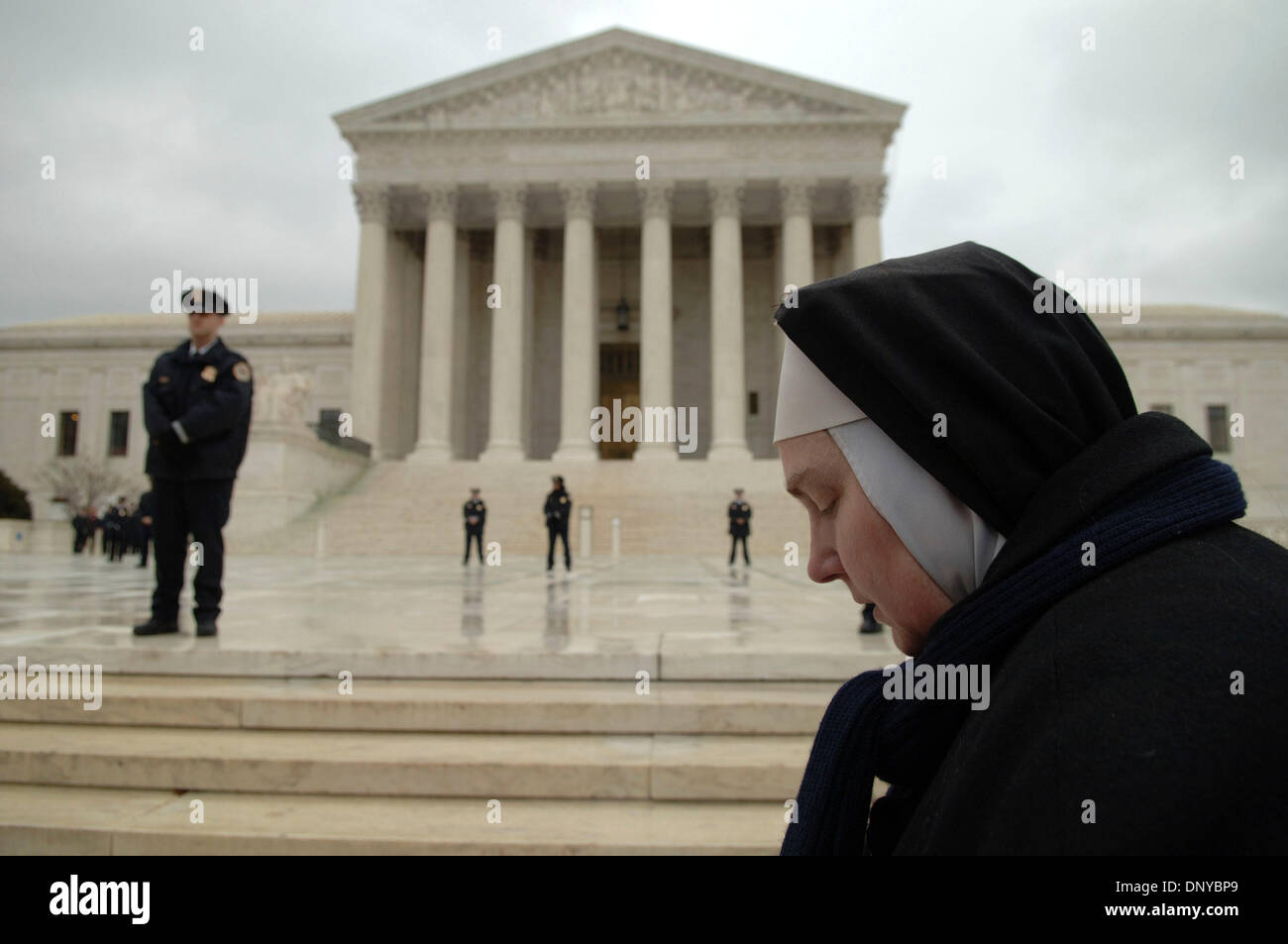 Jan 23, 2006; Washington, DC, USA; A nun prays in front of the Supreme ...