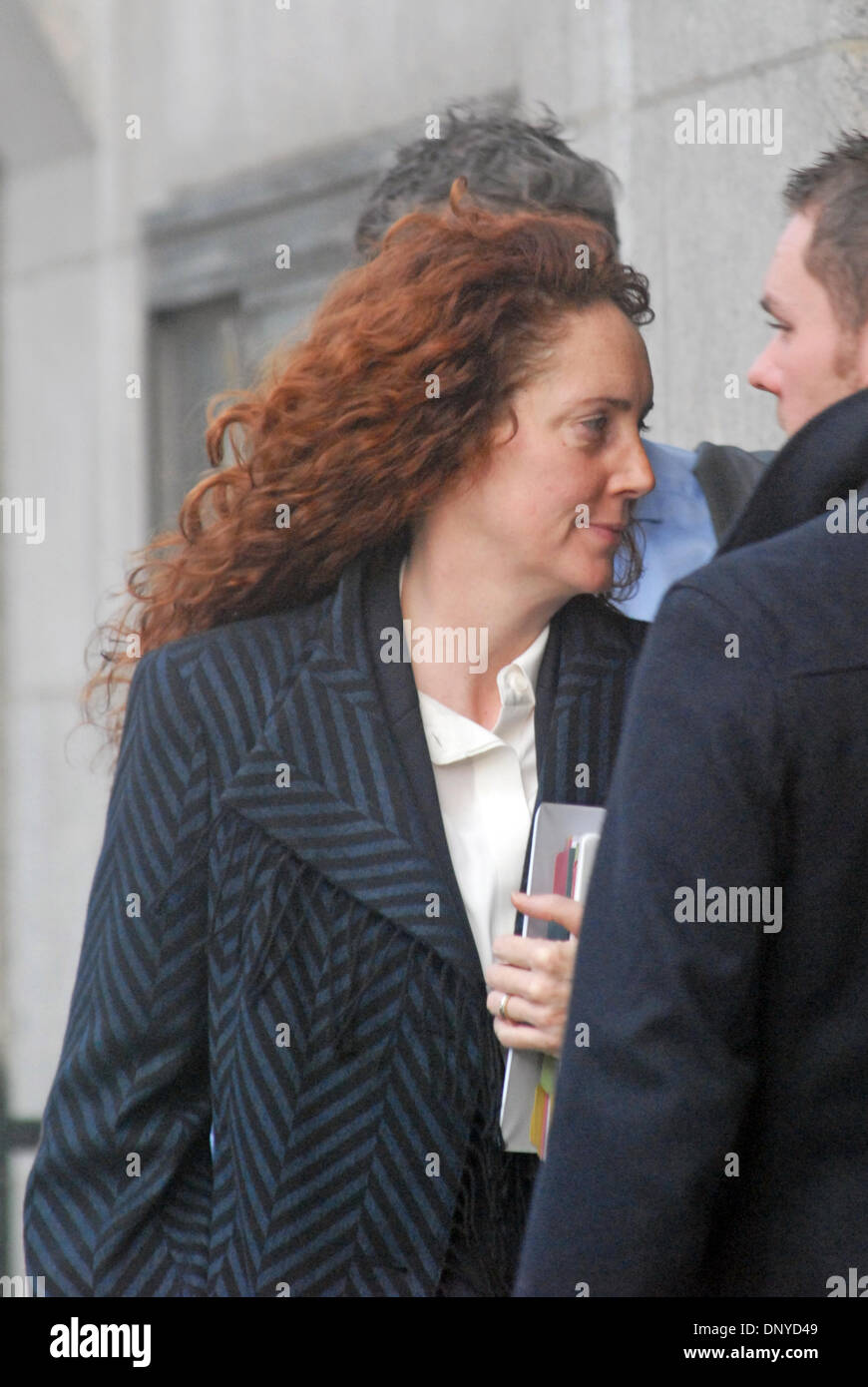 London, UK. 6th Jan, 2014. Rebekah Wade avoids the cameras arriving at ...