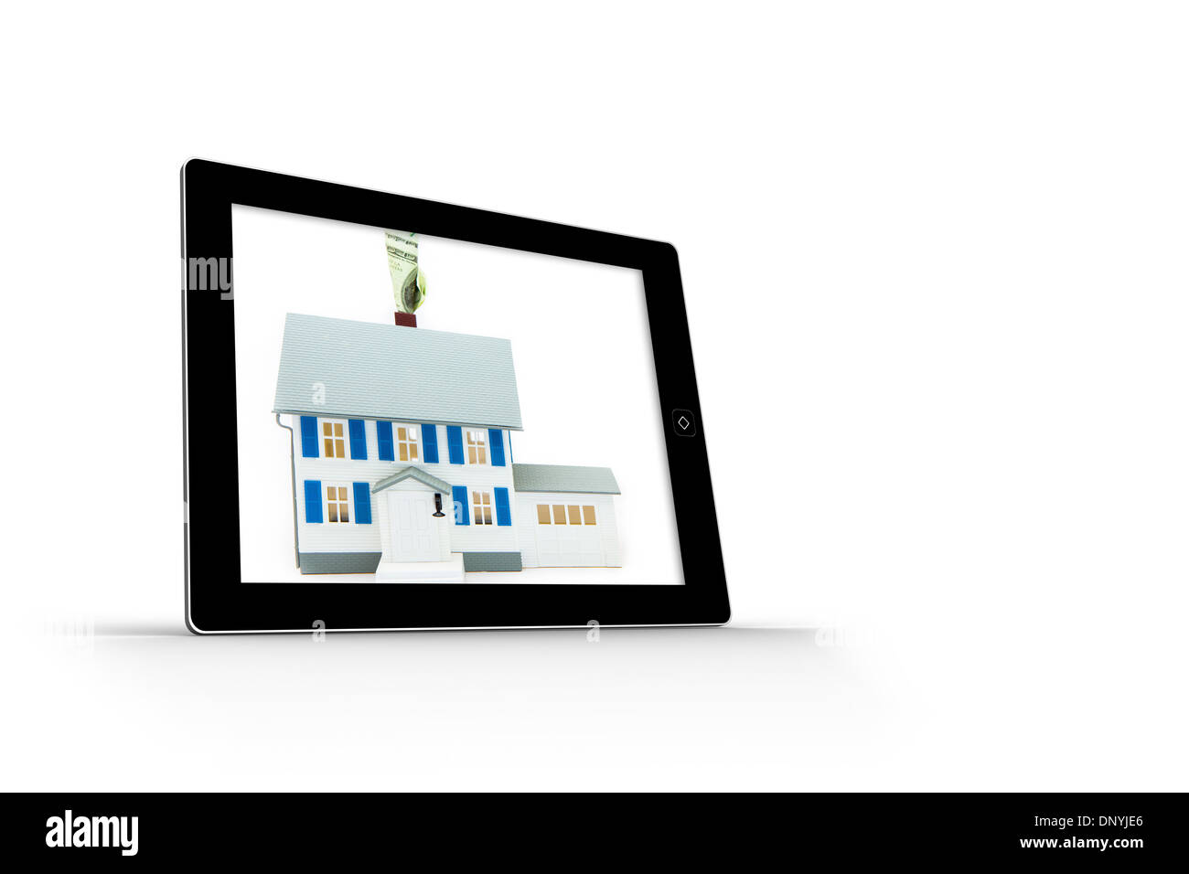 House with price tag on tablet screen Stock Photo - Alamy