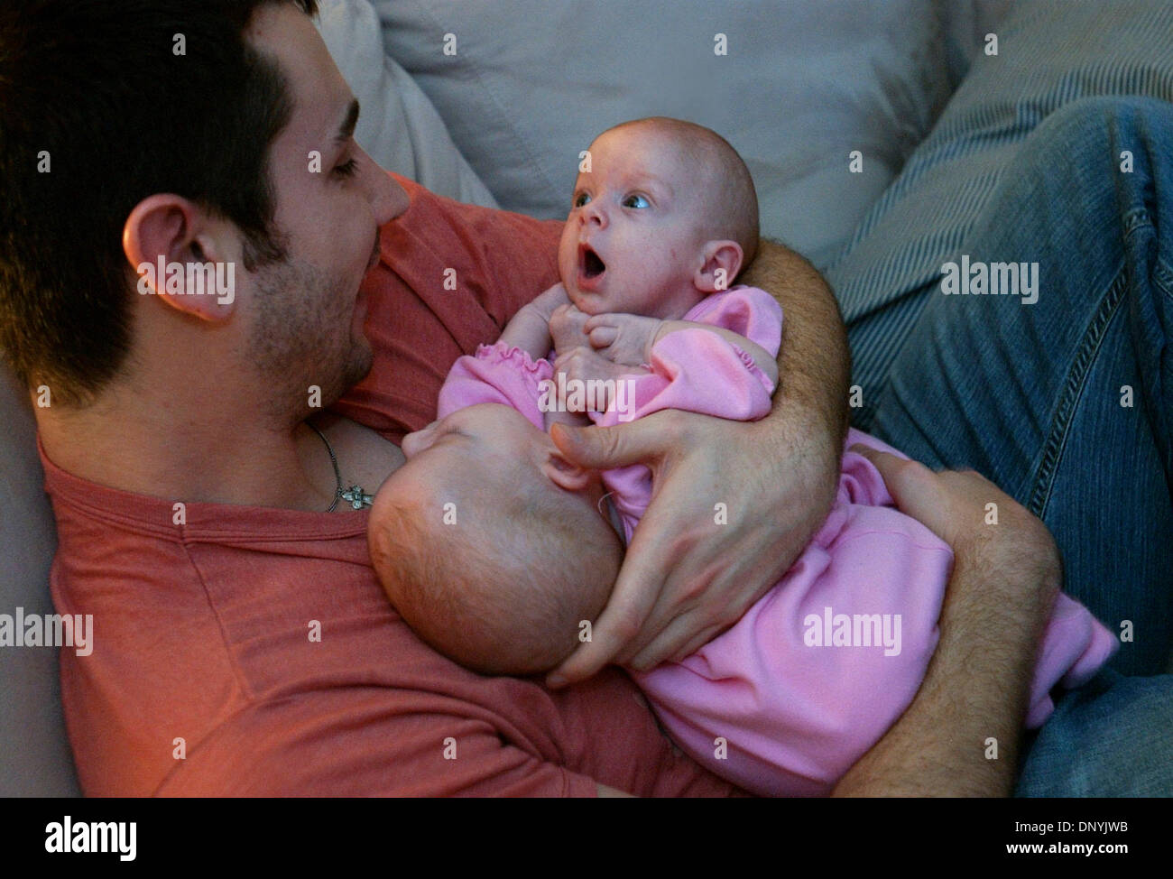 Feb 01, 2006; Fargo, ND, USA; Jesse Carlsen holds his twin girls, (left ...