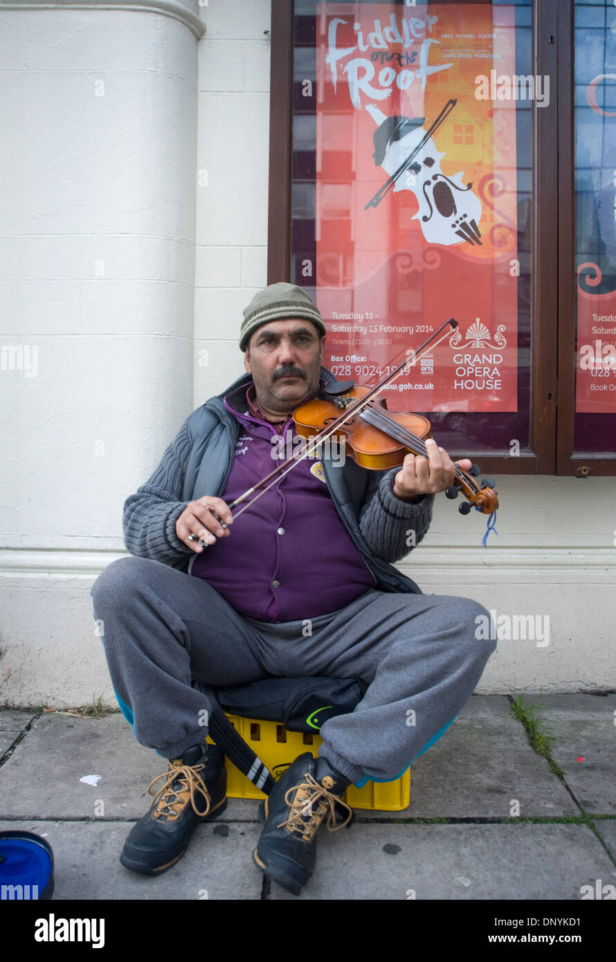 Romanian Busker outside Grand Opera House, Belfast Stock Photo - Alamy