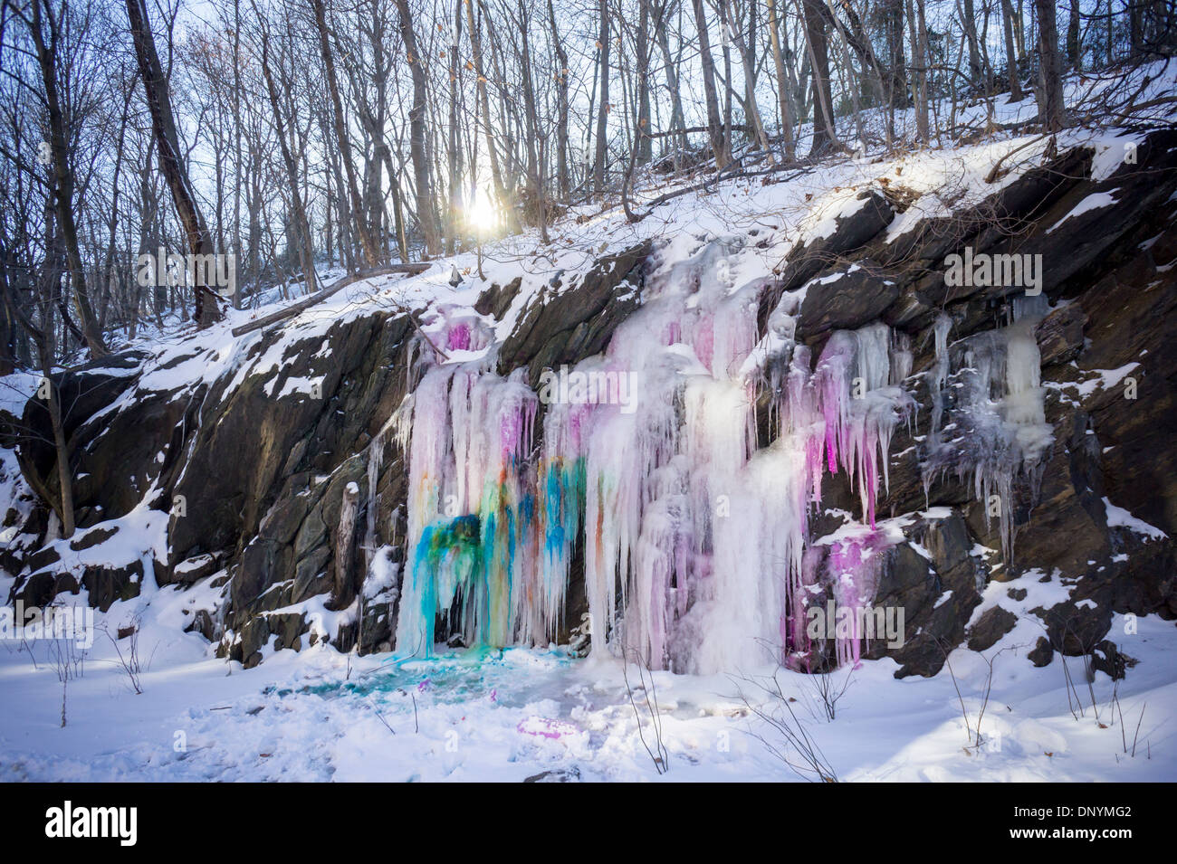 A waterfall comprised of colored icicles is seen on Dyckman Street in ...