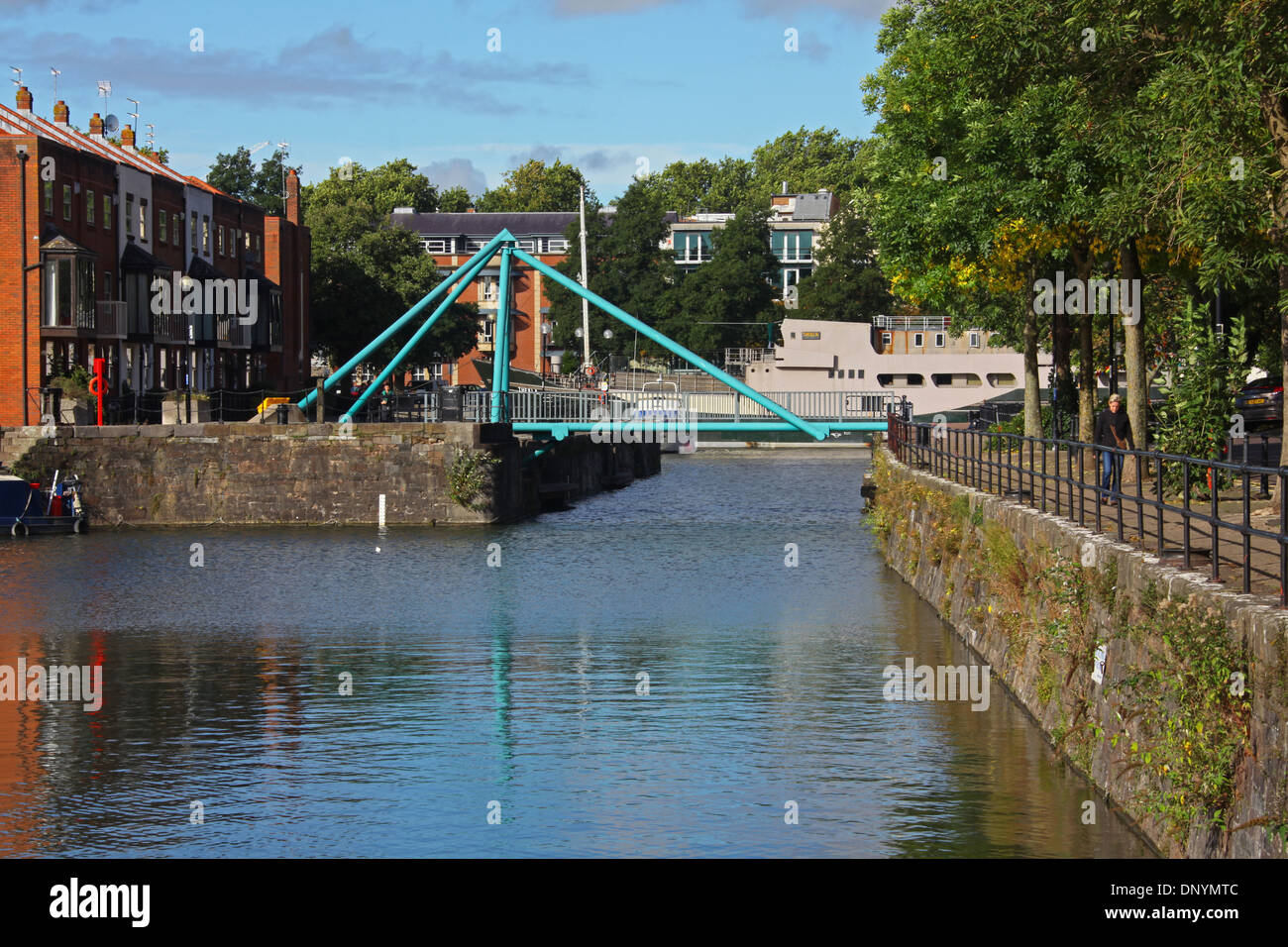 A nicely designed blue painted tubular steel swing bridge acting as a ...