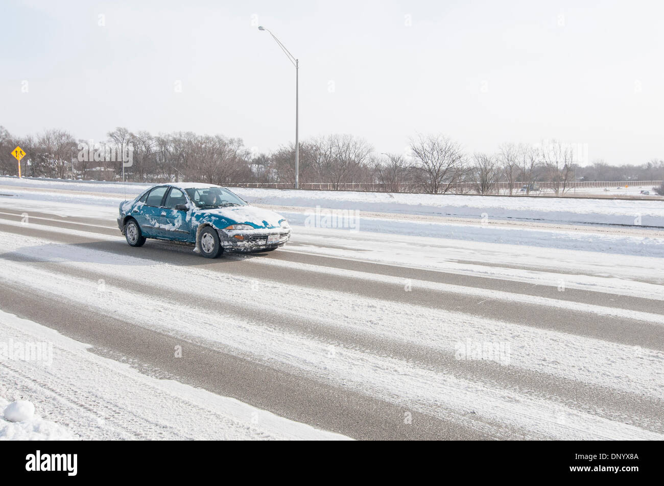 Chicago, Illinois, 6 January 2014. In the western suburbs, a car drives ...