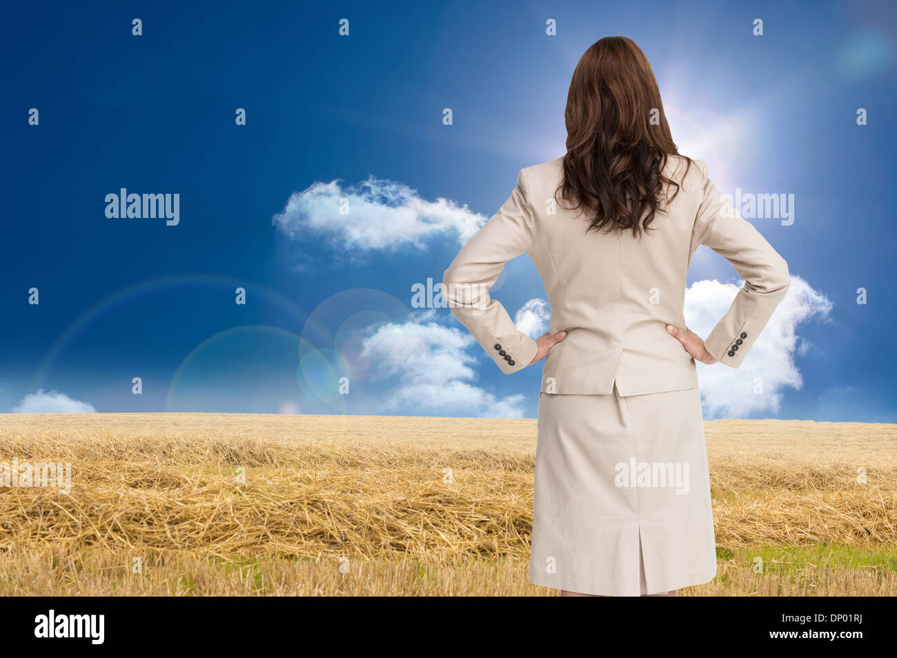 Composite image of businesswoman standing back to camera Stock Photo ...