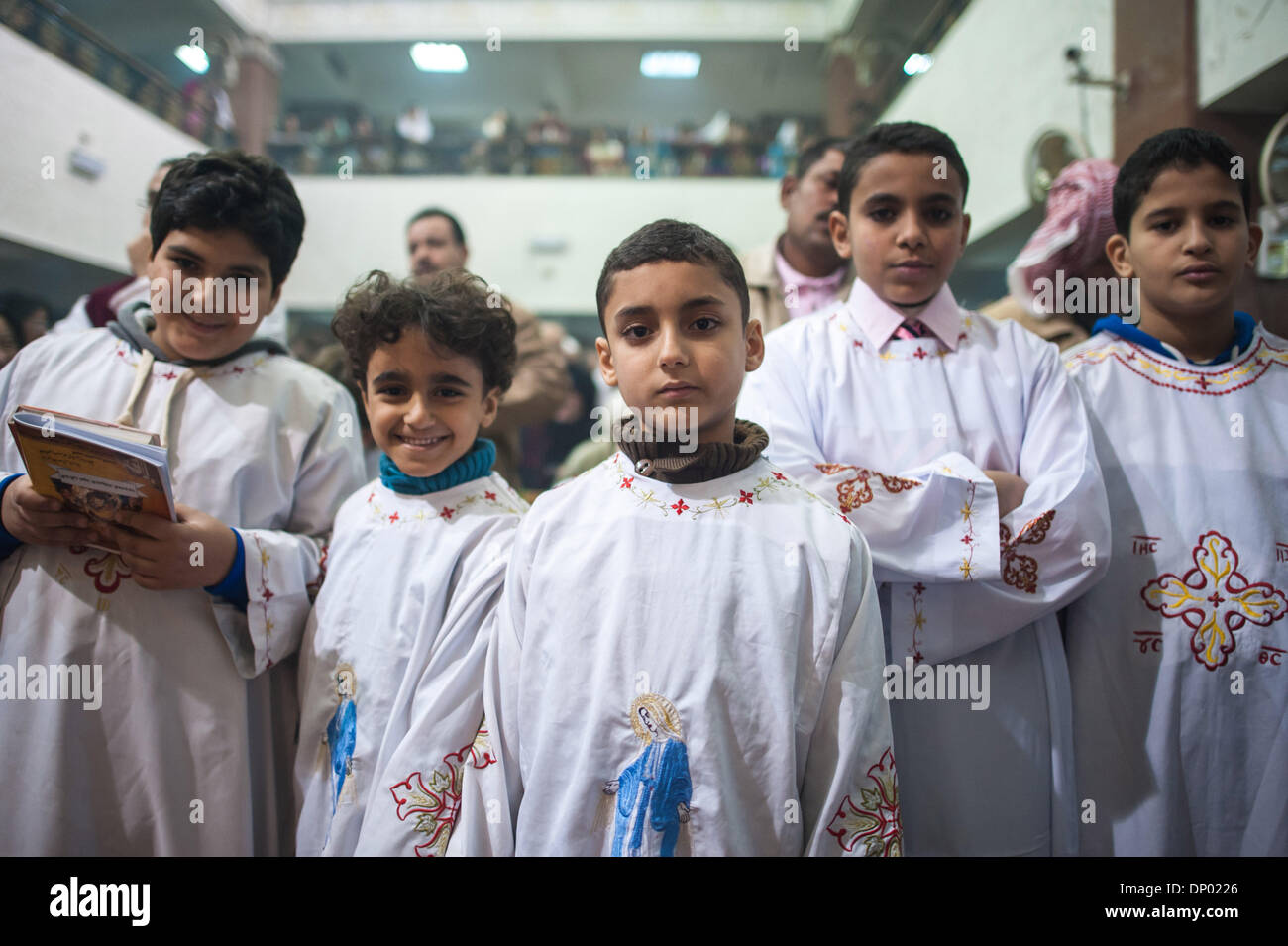 Cairo, Egypt. 7th Jan, 2014. Coptic altar boys pose before the Coptic ...