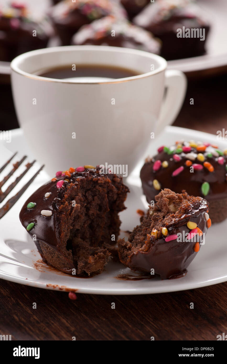 spongecake or muffin with chocolate sauce and cup of coffee Stock Photo ...