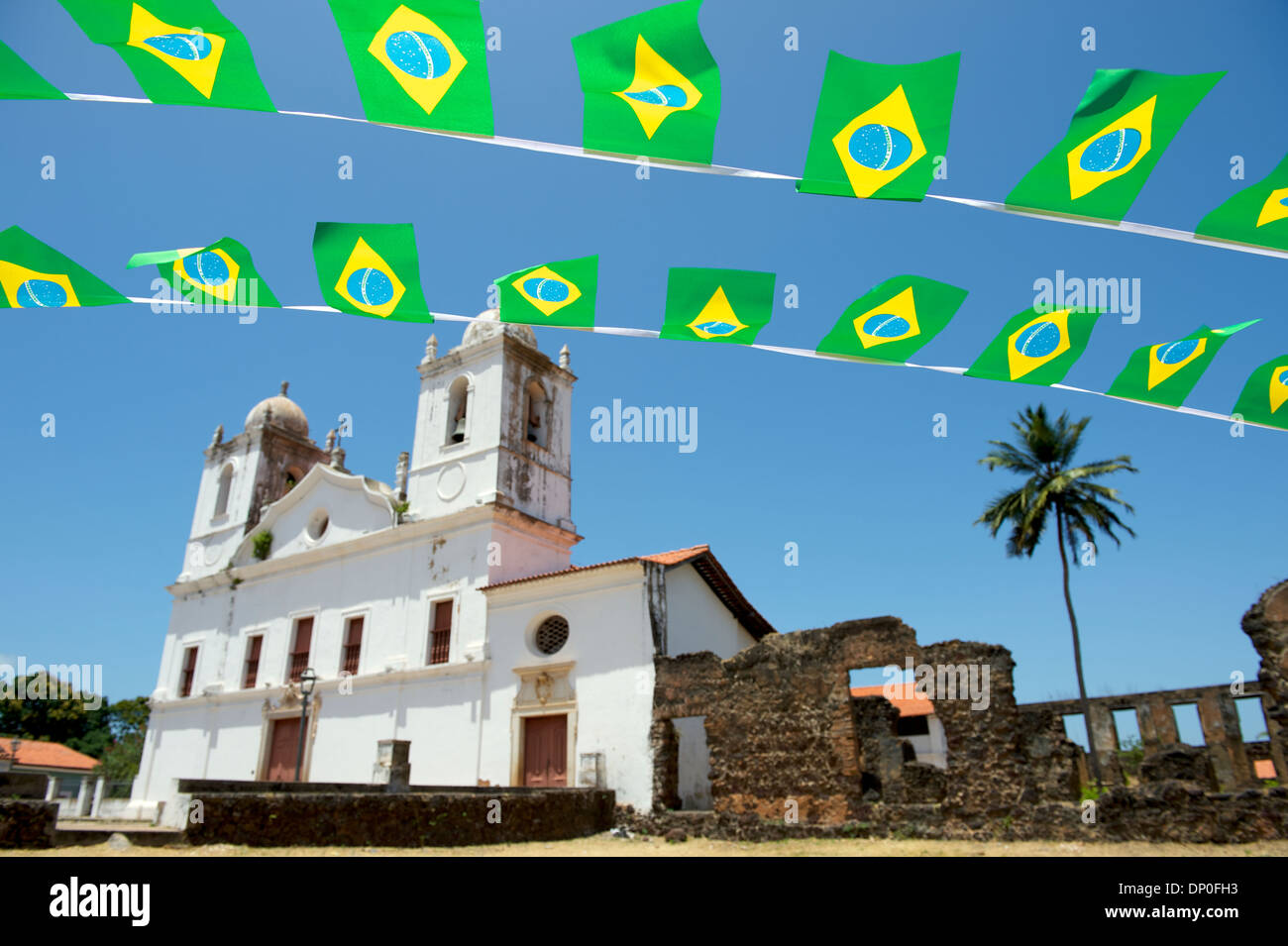 Brazilian flag bunting flying over typical simple white colonial Carmo ...