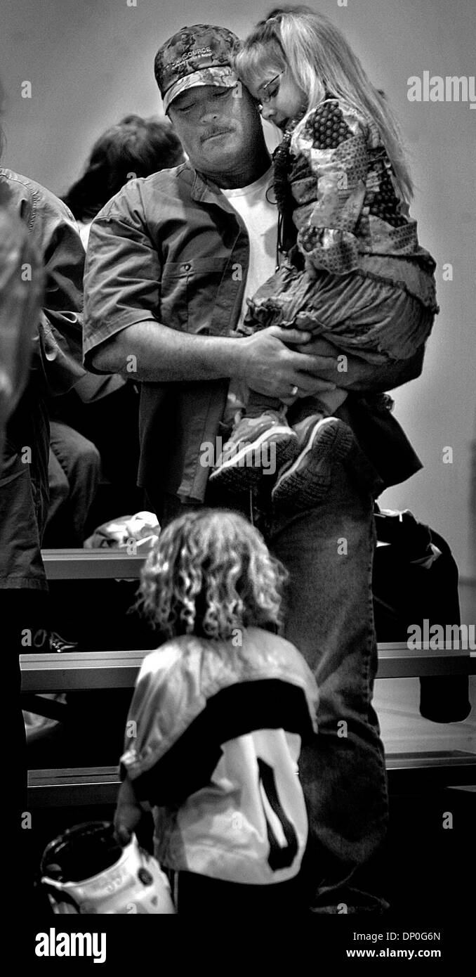 Mar 18, 2006; Bloomington, MN, USA; Family friend Chuck Grant holds ...