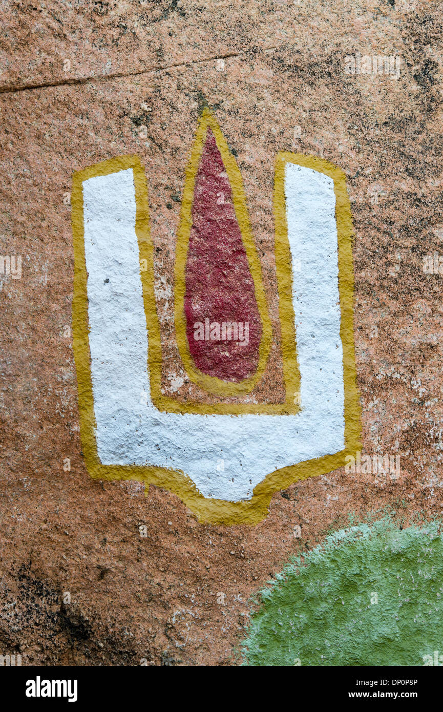 Venkateswara symbol painted on a rock outside a hindu temple in Andhra ...