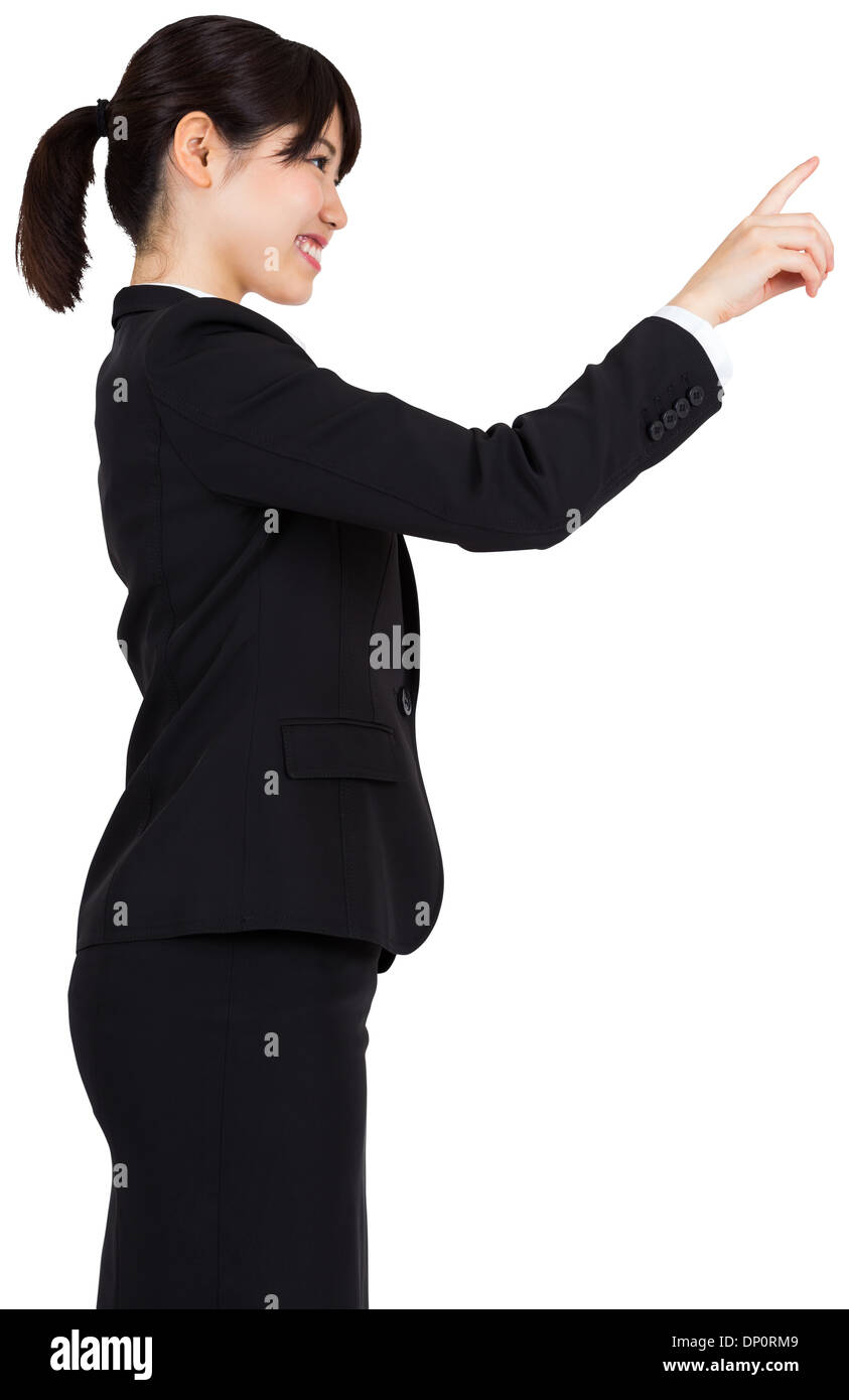 Smiling businesswoman pointing Stock Photo - Alamy